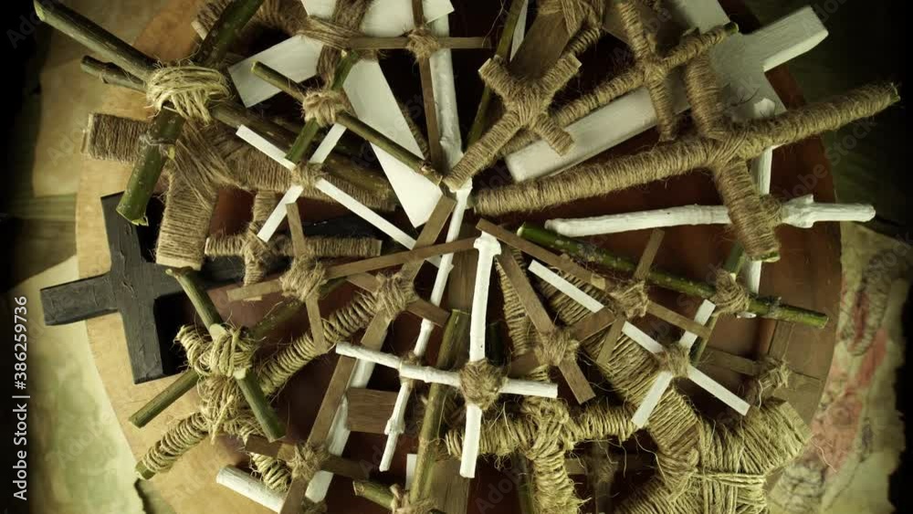 Different wooden crucifixes cross on the table. Handmade religion ...