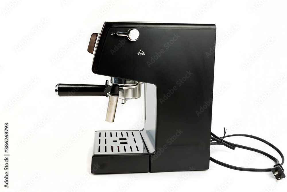 Black and silver espresso machine with cord coiled behind it side view ...