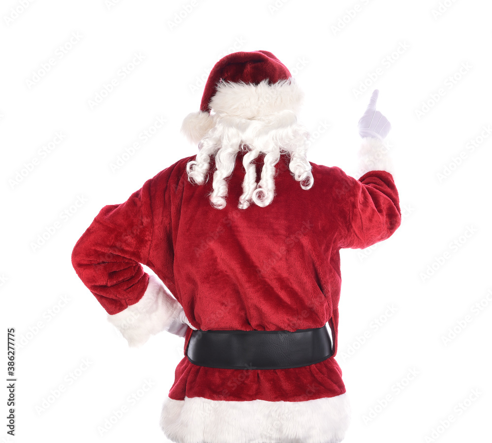 Santa Claus seen from behind with one hand pointing and the other on ...