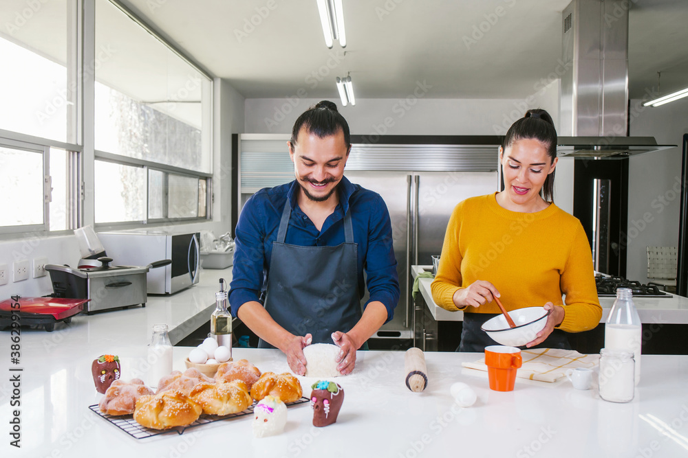 Mexican people cooking Pan de Muerto traditional bread for day of the ...