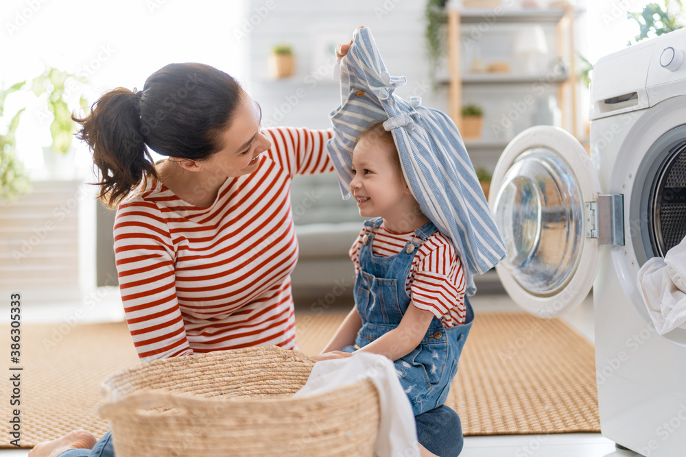 family doing laundry Stock Photo | Adobe Stock