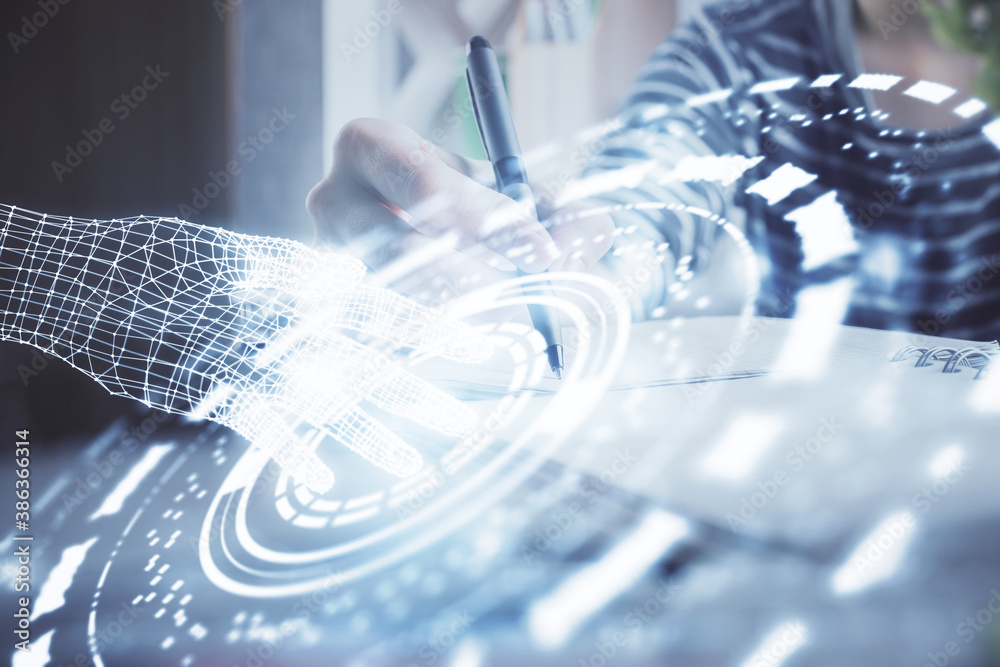 Double exposure of hands making notes with digital coding icons ...