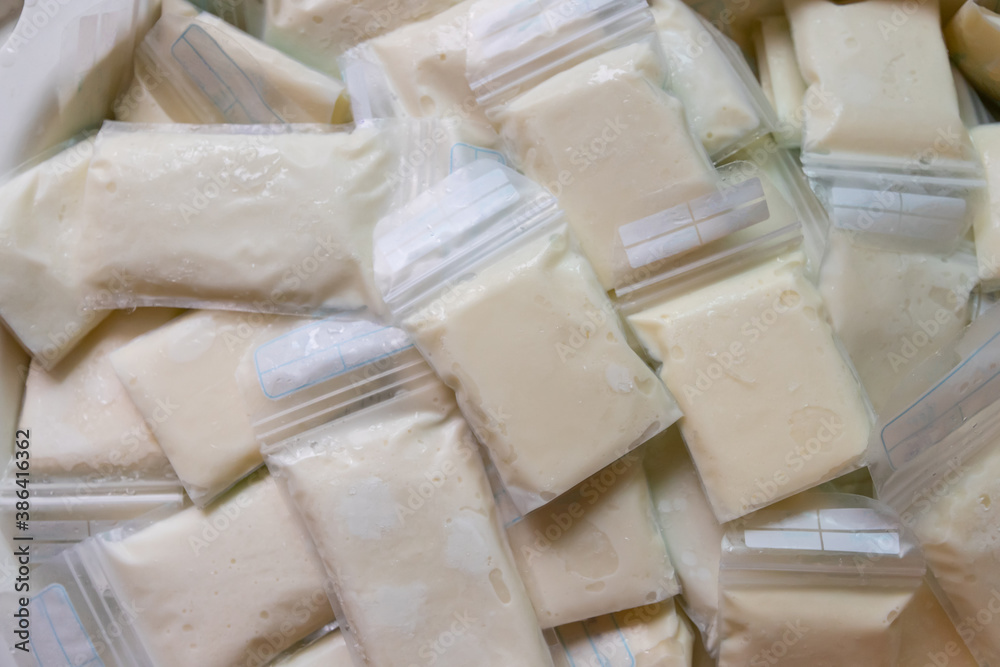 frozen breast milk in plastic bags. melting frozen mother milk ...