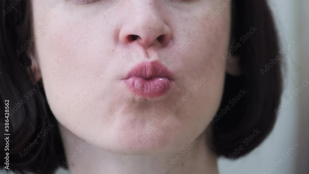 Stockvideo Close-Up Brunette Woman Smiles and Sends Kiss. On Face Smile ...