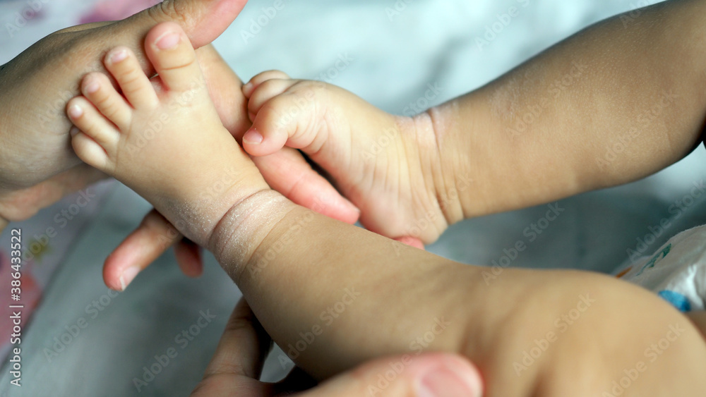 Close-up of the folds of the foot of a newborn baby with red skin ...