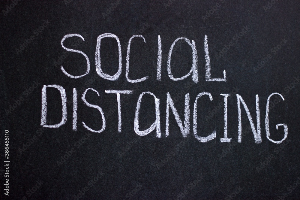Social distance is a protective measure against Covid-19. Text on ...
