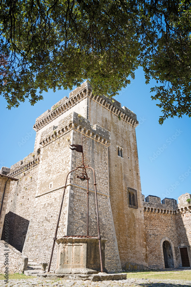 Stone walls, water well and the tower of the famous Caetani Castle of ...