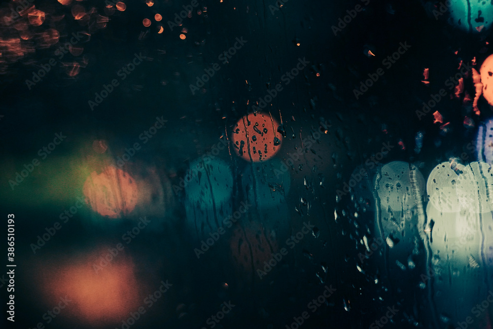 Rain drops on car window with road light bokeh, City life in night in ...