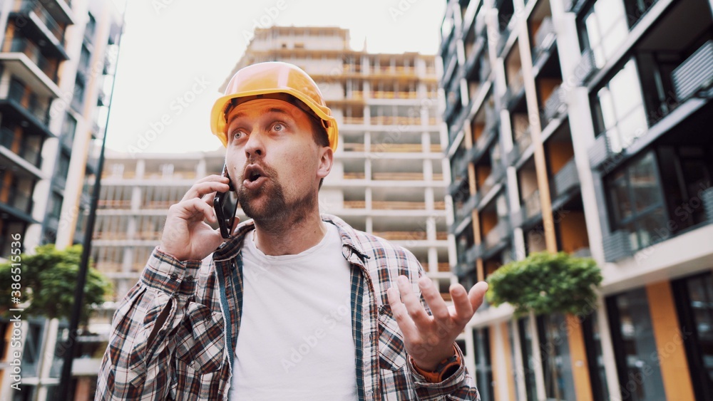 Angry builder, dissatisfied with deadline of work, swears at stress ...