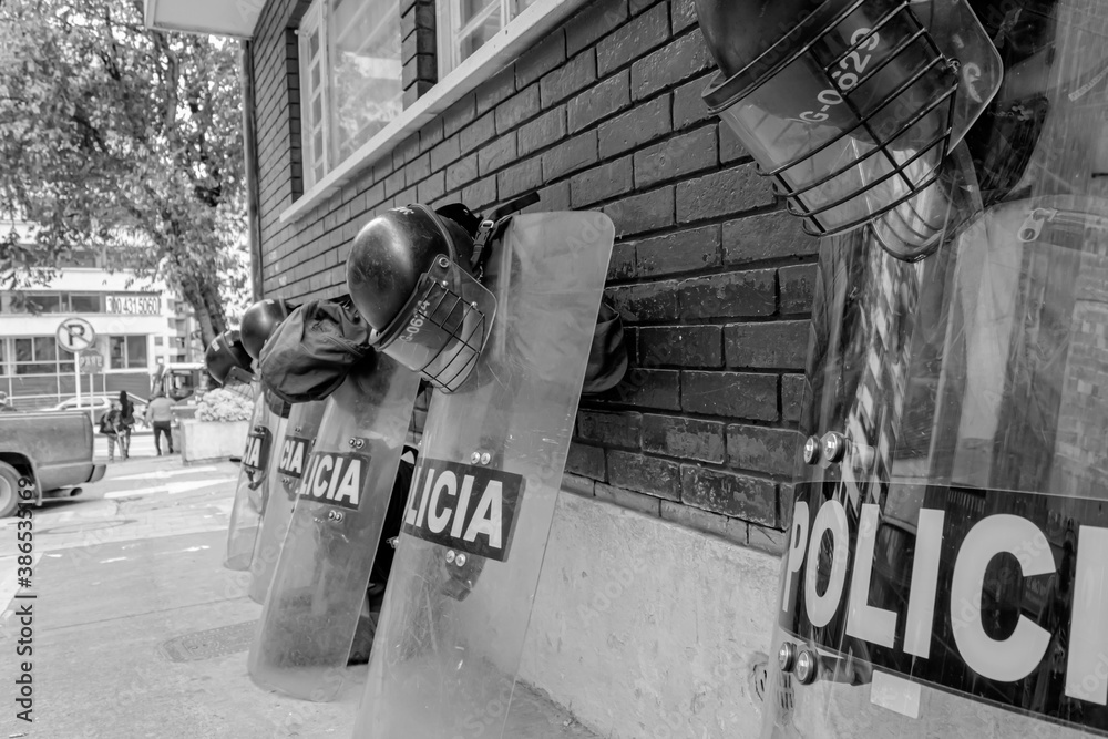 Foto de BOGOTA, COLOMBIA - Police Riot helmets and shields over a brick ...