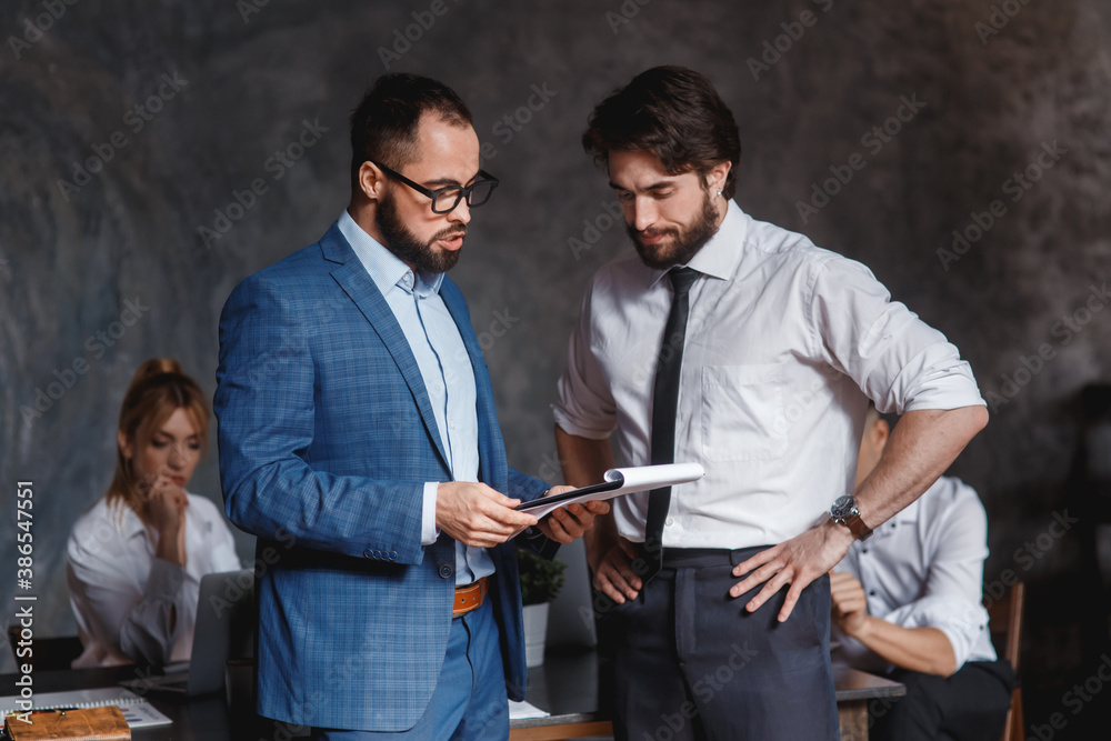 caucasian colleagues disputing having disagreement at work blaming each ...