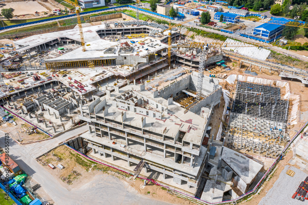 concrete construction site for big building foundation. tower cranes ...