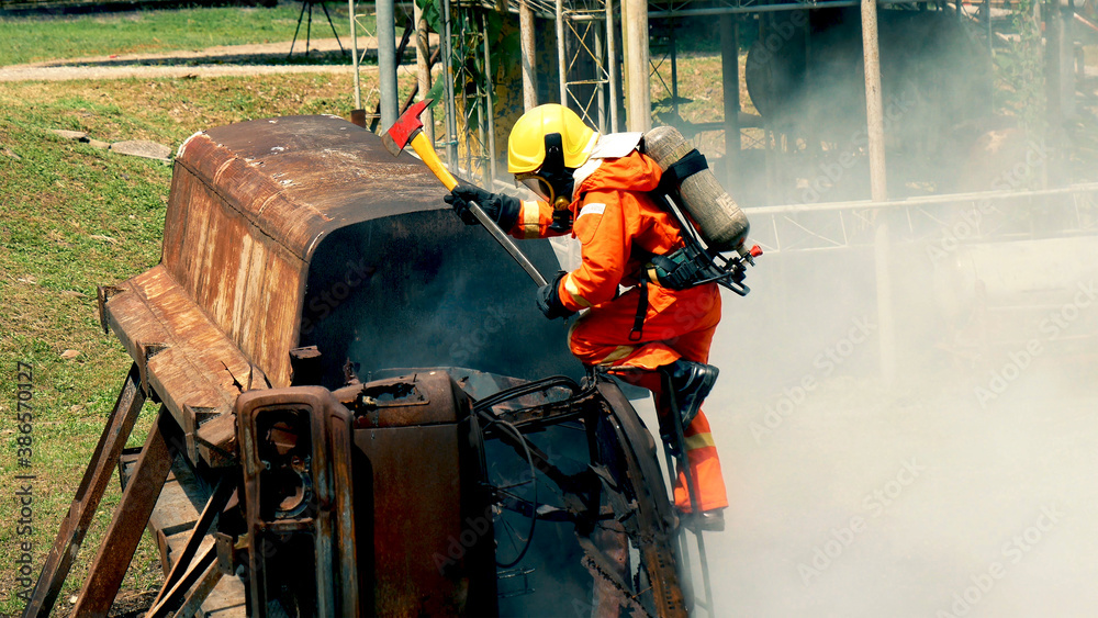 Firefighter fighting with flame using fire hose chemical water foam ...