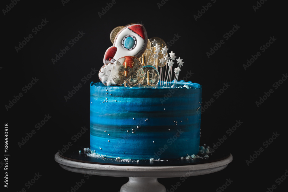 Space-themed cake on the black background Stock Photo | Adobe Stock
