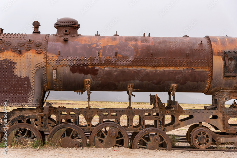 Old rusty locomotive abandoned in a train cemetery. Uyuni, Bolivia ...
