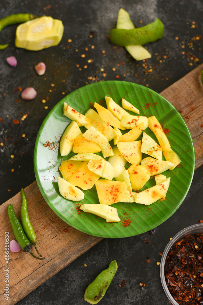 Sliced green mango with chili powder , salt street food snack Kerala ...