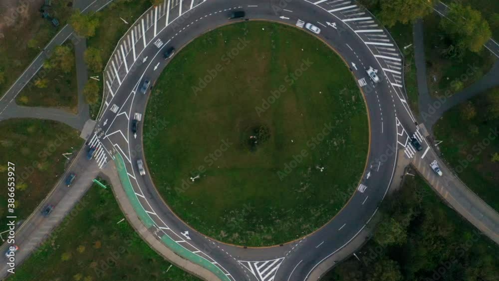 A top down view directly over an automobile roundabout. The drone ...