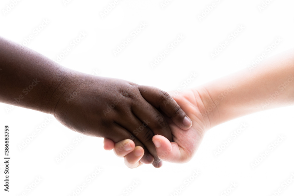 hands touching hands holding between african and caucasian kids over ...
