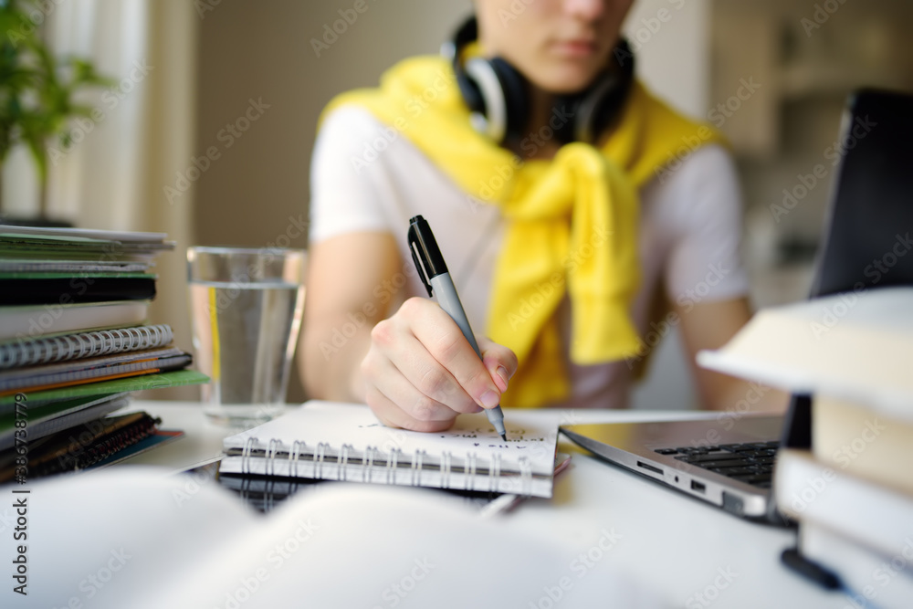 Teenager boy study at home. Online education and distance learning for ...