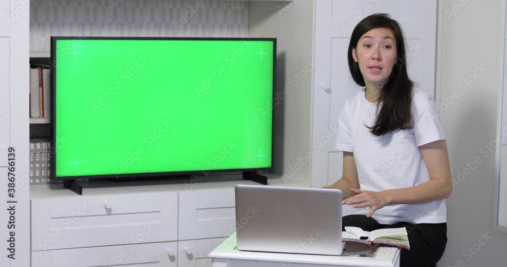 Vidéo Stock Young female teacher giving online lesson on laptop via ...