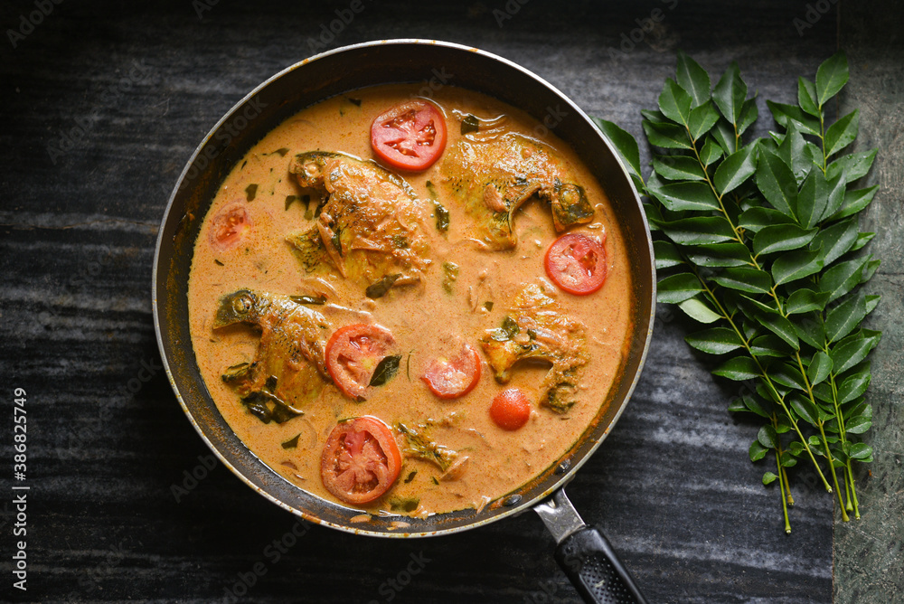 Top view spicy Kerala Style Fish stew and Appam Fish Molee or Meen ...