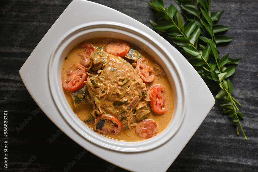 Top view spicy Kerala Style Fish stew and Appam Fish Molee or Meen ...