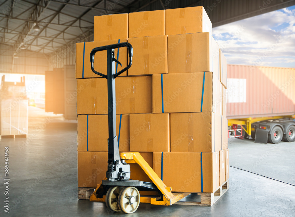 Cargo shipment boxes, Freight truck, Warehousing. Hand pallet jack with ...