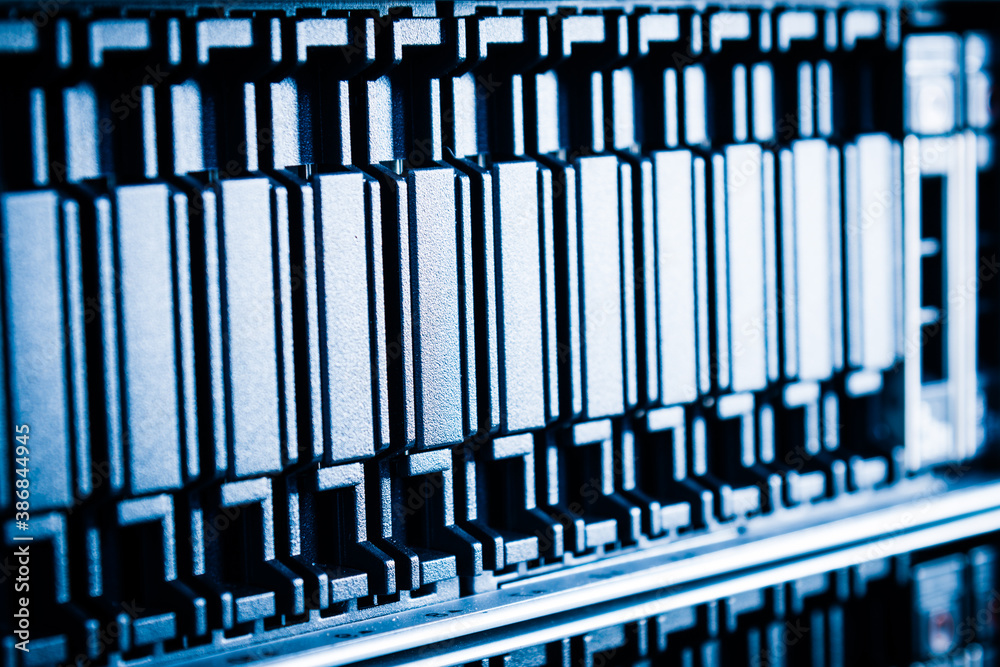 Foto de cluster of data storage SSD hard drives inside server rack do ...