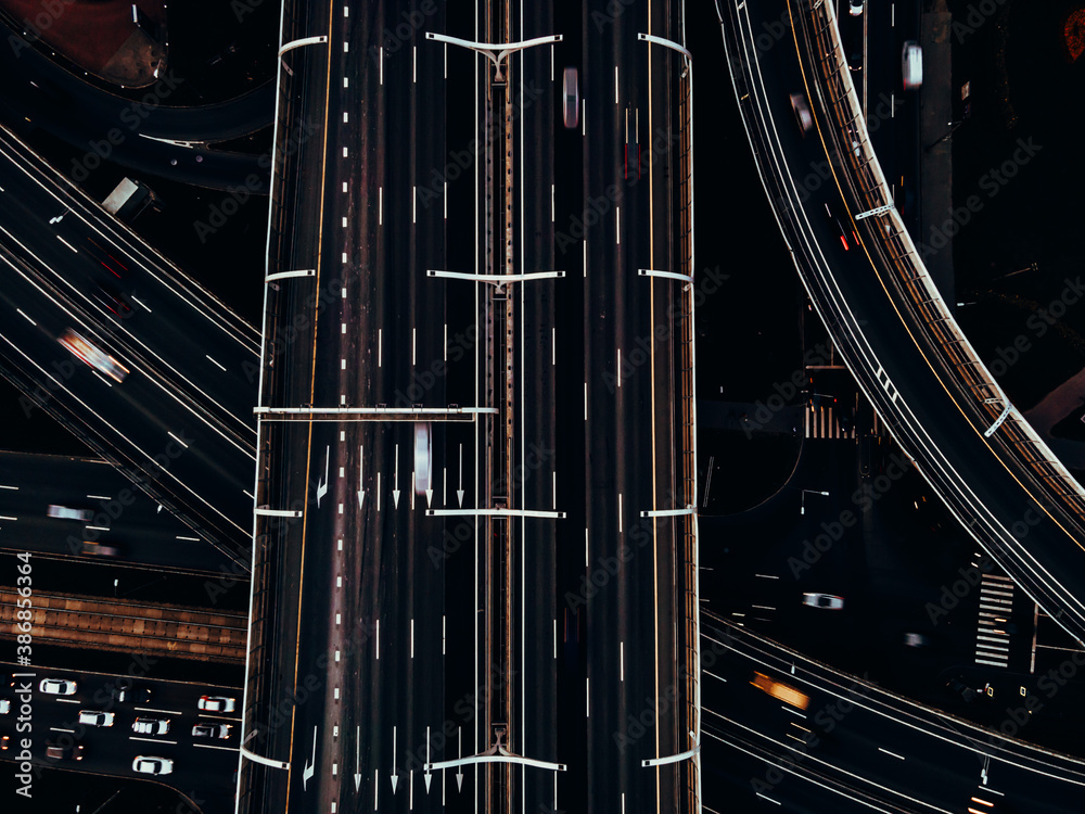 Top-down view of a car driving through the city and overtaking other ...