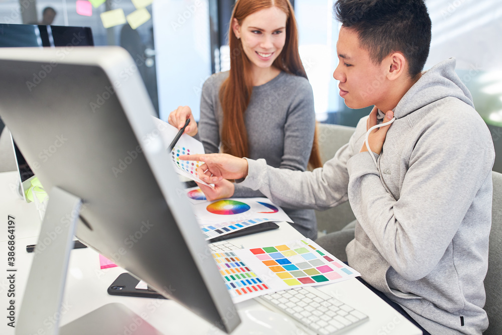 Web design team discusses color design Stock Photo | Adobe Stock