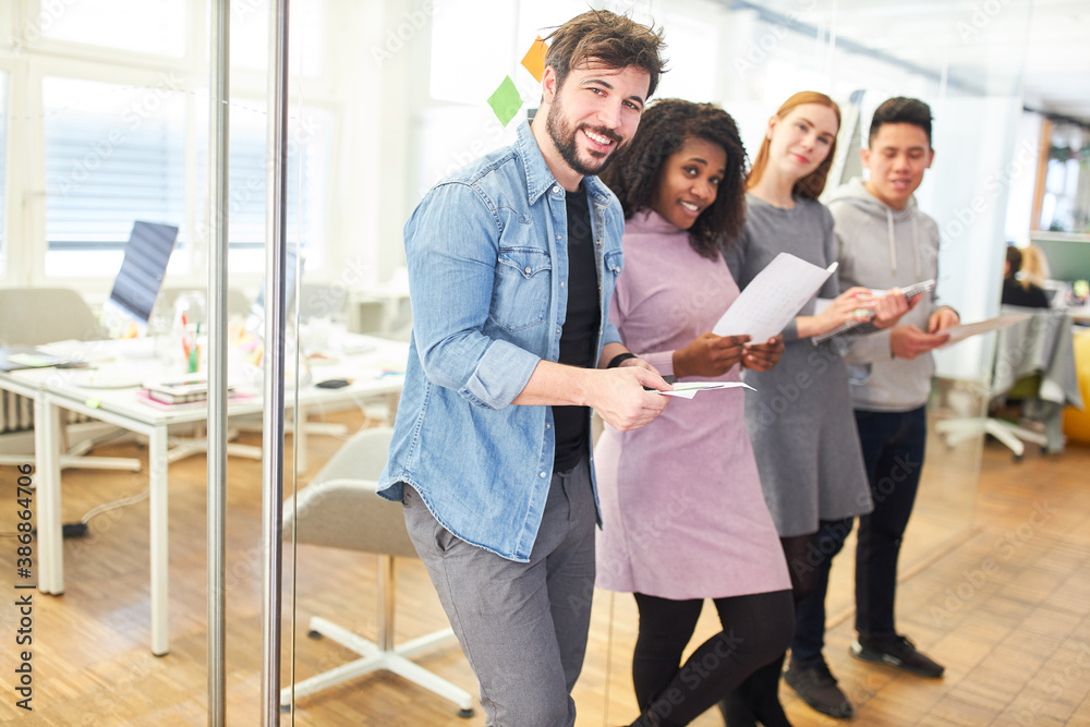 Start-up team of a design agency with trainees Stock Photo | Adobe Stock