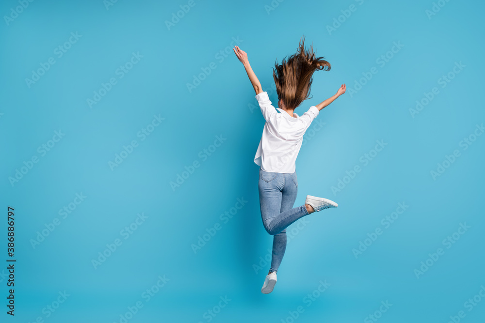Full length rear behind view photo of lady jump high up raise arms wear ...