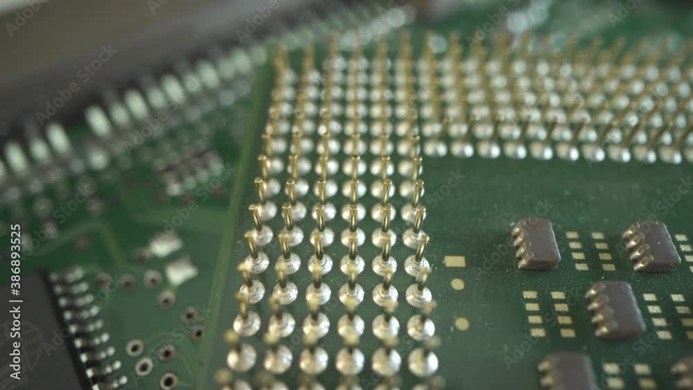 CPU microprocessor in super macro shot. Many connectors, chip, cores of ...