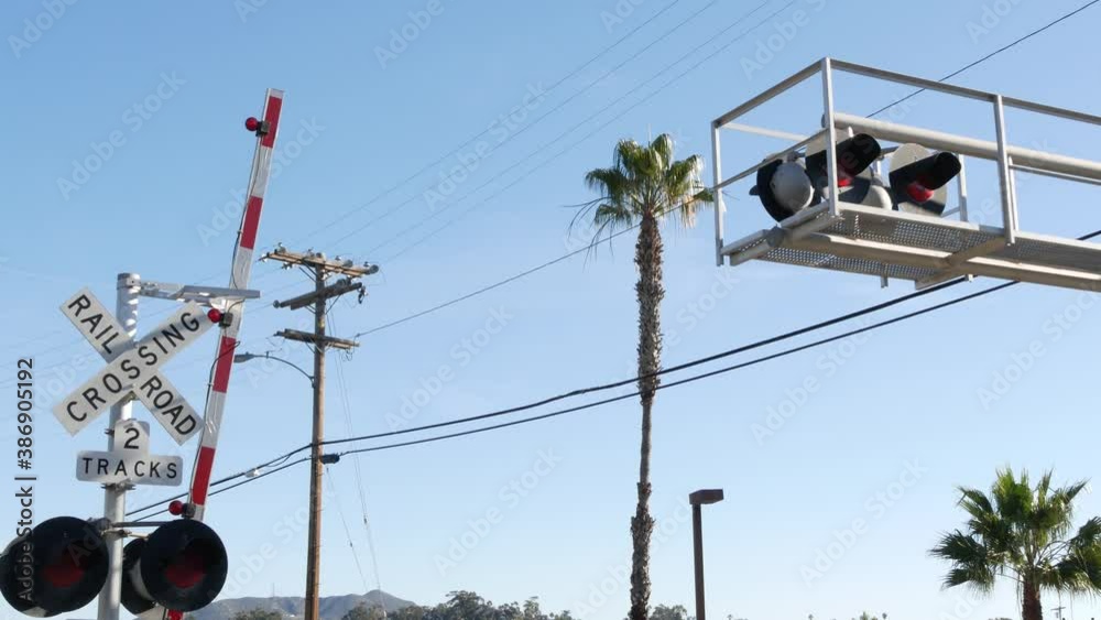 Level crossing warning signal in USA. Crossbuck notice and red traffic ...