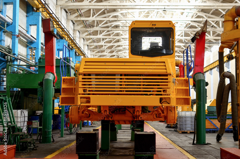 Production process of heavy mining trucks at the factory. Dump truck on ...