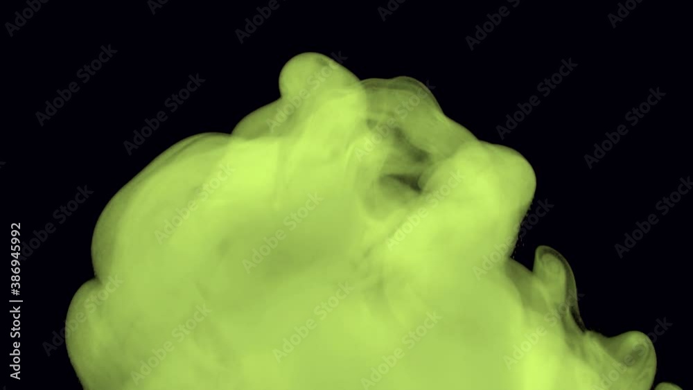 Abstract steam mist of green color on a black background.A gaseous ...