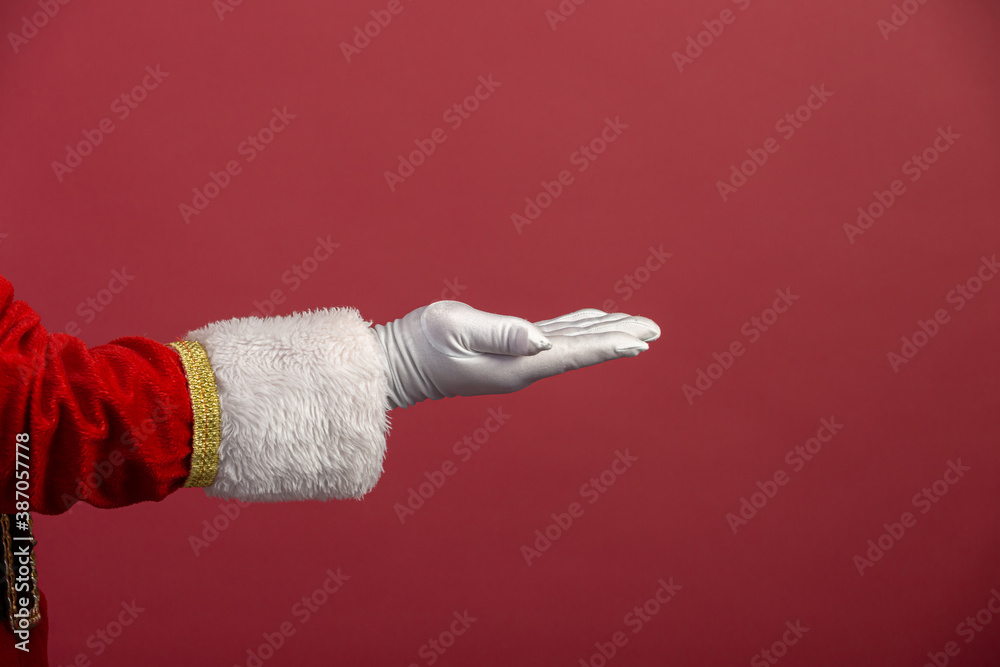 Photo of Santa Claus gloved hand in showing gesture. Santa Claus ...