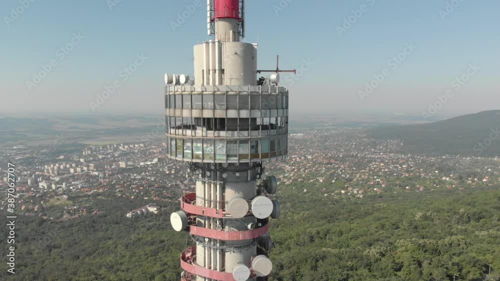 Aerial / drone footage of the Pécs TV Tower. Pécs is the fifth largest ...