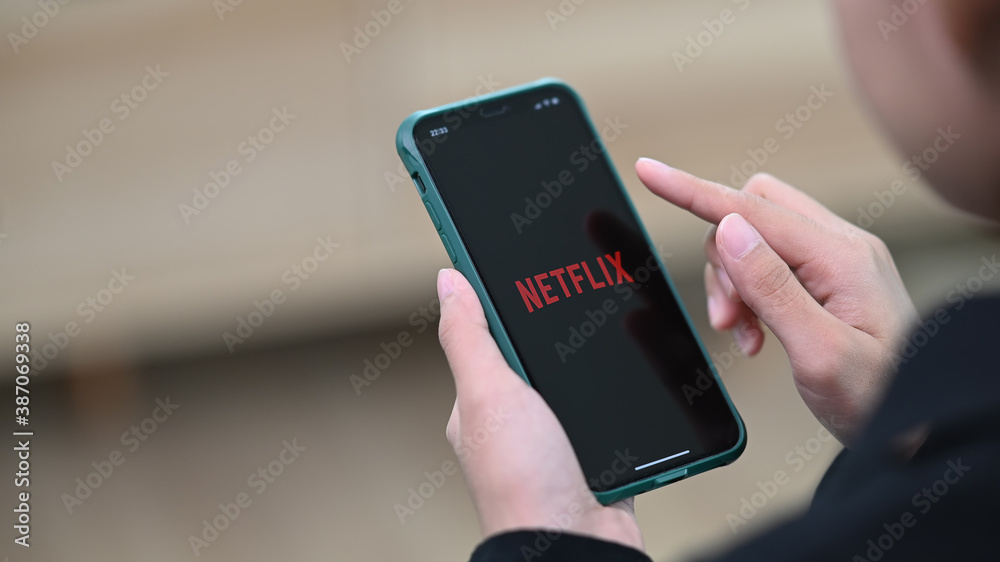 CHIANGMAI, THAILAND - Oct 22 ,2020: Young woman opening Netflix in her ...