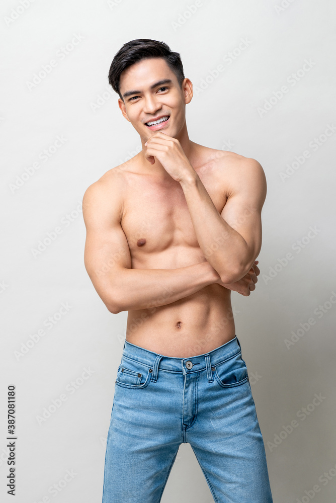 Poster Muscular handsome shirtless Asian man smiling and posing in ...