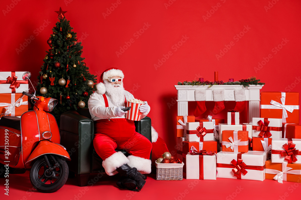 Full size photo of santa claus hold pop corn box switch remote control ...