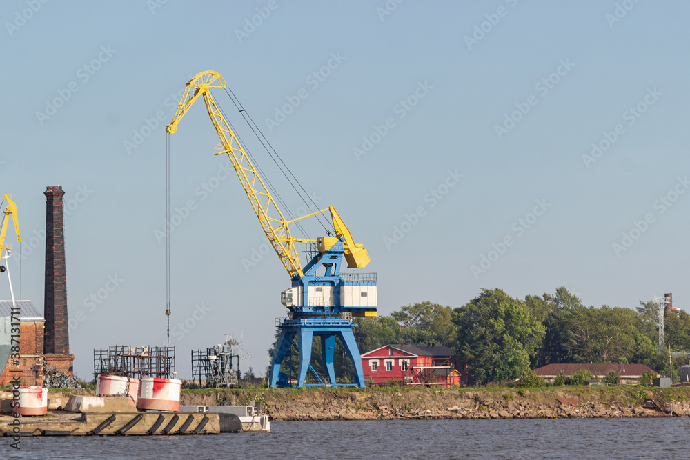 Foto de large port crane in the docks lifts structures. Cargo ...
