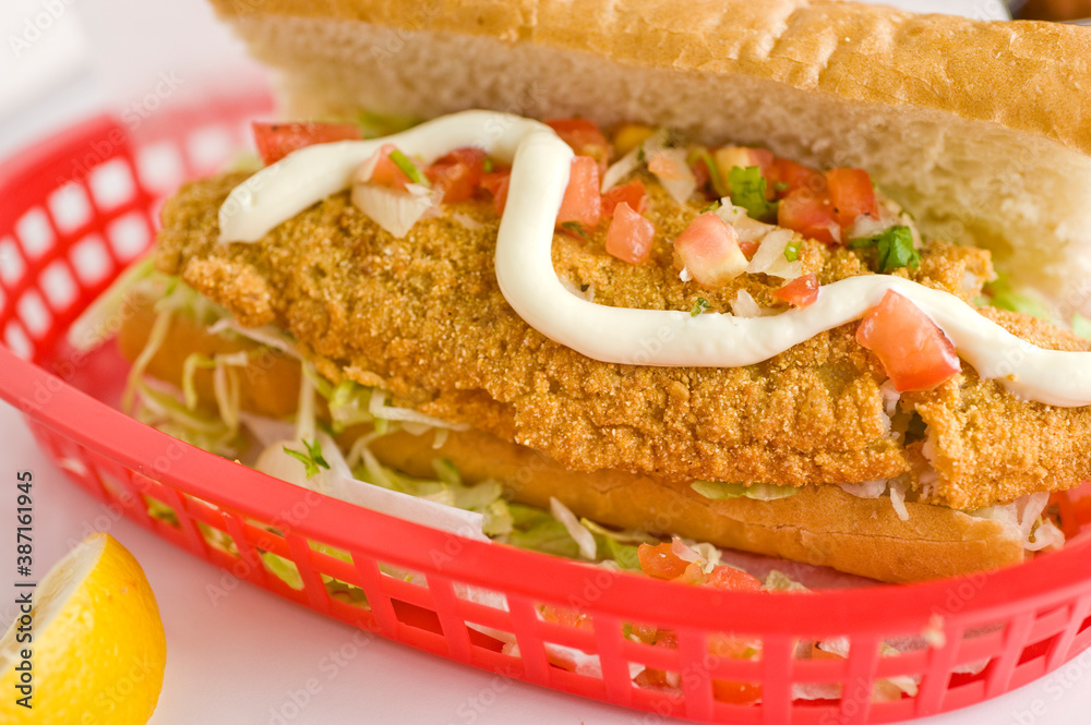 Fried fish or po boy sandwich. Classic Cajun cuisine: fried fish ...