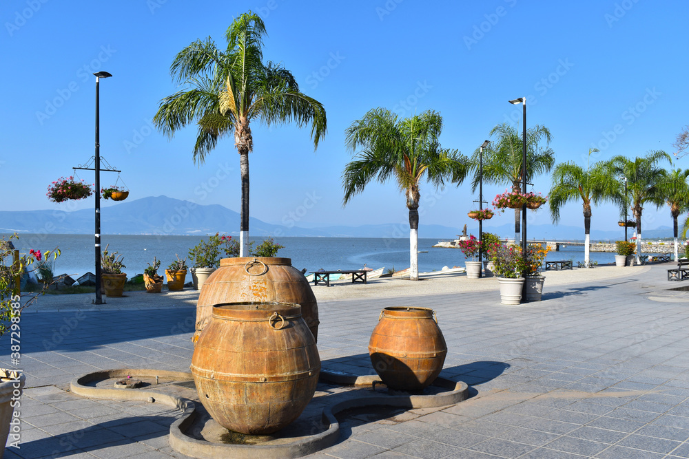 View of the BoardWalk of Chapala with a fountain shaped like barrels ...