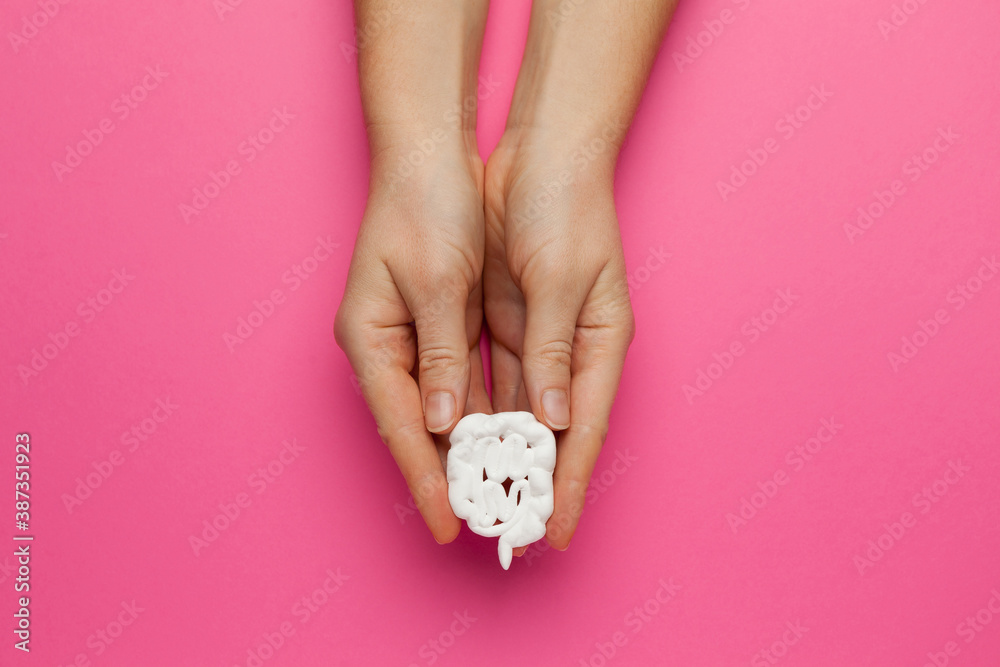 Intestines and hands on a pink background. Gastrointestinal tract ...