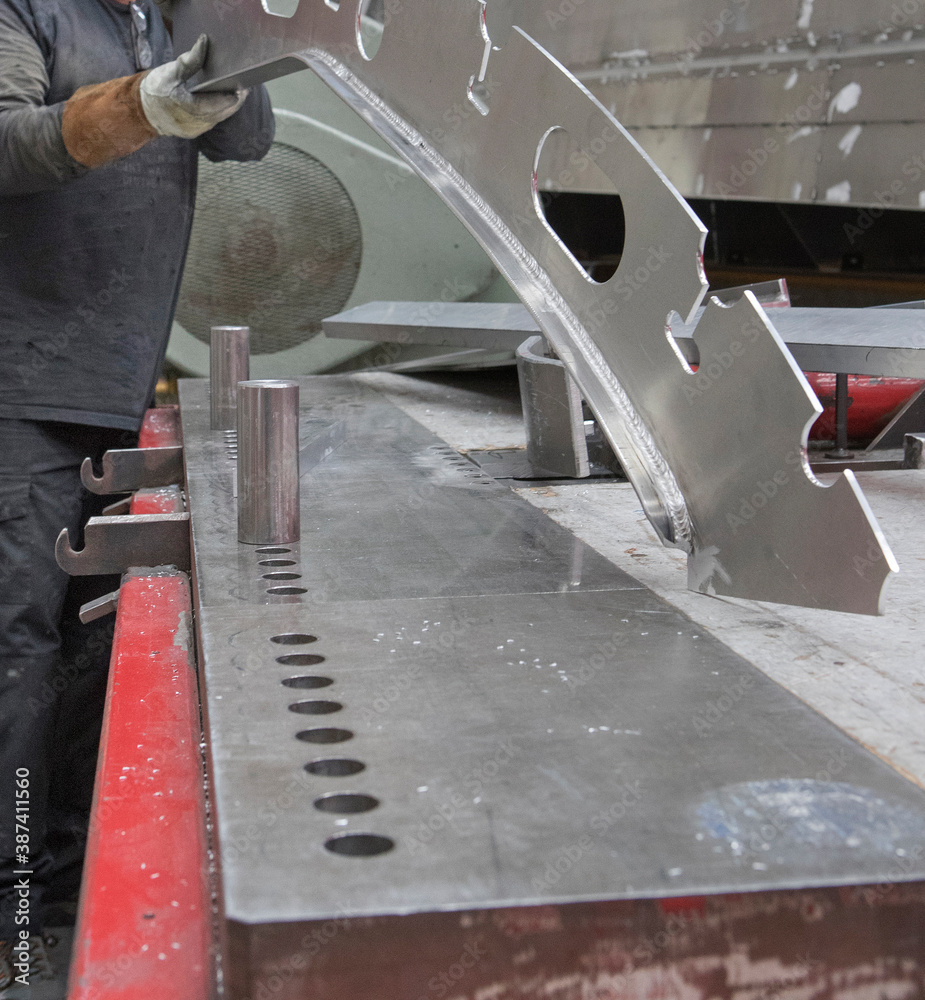 Bending. Aluminium hull of a super sailing yacht. Shipyard. Aiur frame ...