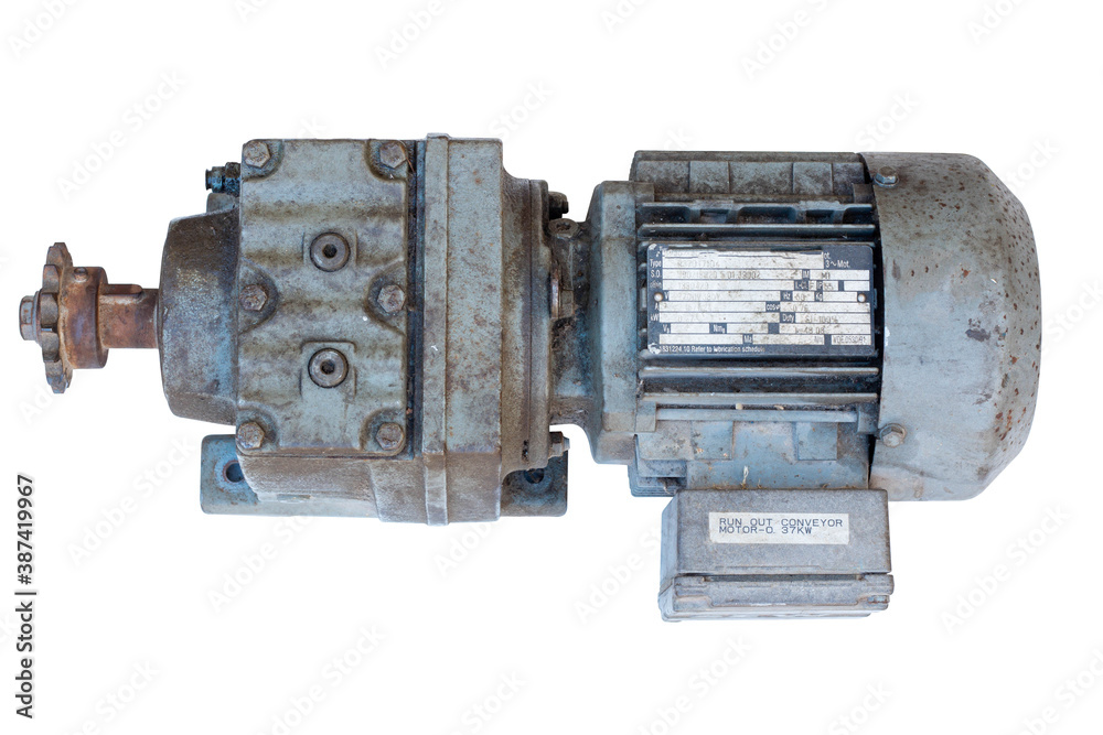 Old motor laid on the floor. The old motor is scrapped. Rusty old motor ...