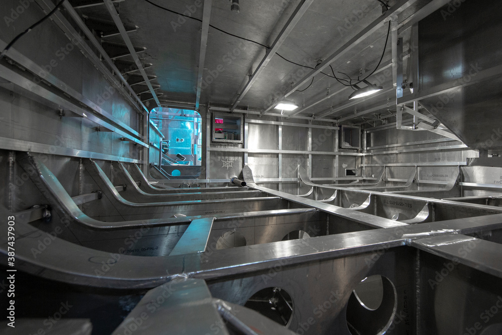 Welding. Aluminium hull of a super sailing yacht. Shipyard. Aiur frame ...