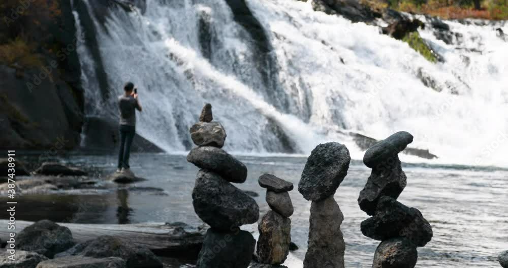 Balanced rocks in front of waterfall and boy Yellowstone 4K ...