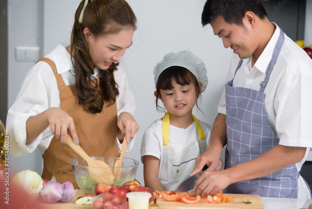 Asian family enjoy with cooking together salad foods homemade in ...